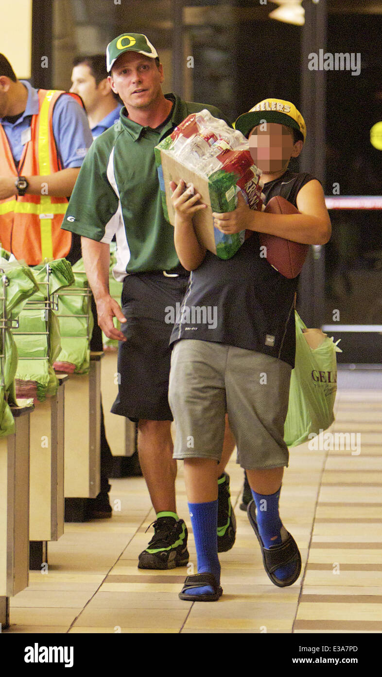 Jason Wiles and his son leaving Gelson's after shopping for groceries ...
