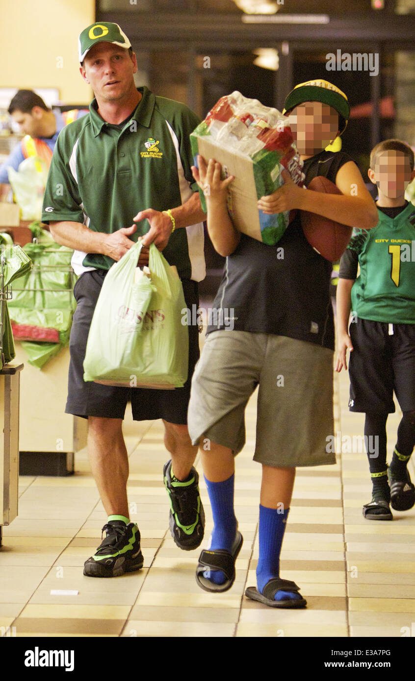 Jason Wiles and his son leaving Gelson's after shopping for groceries ...
