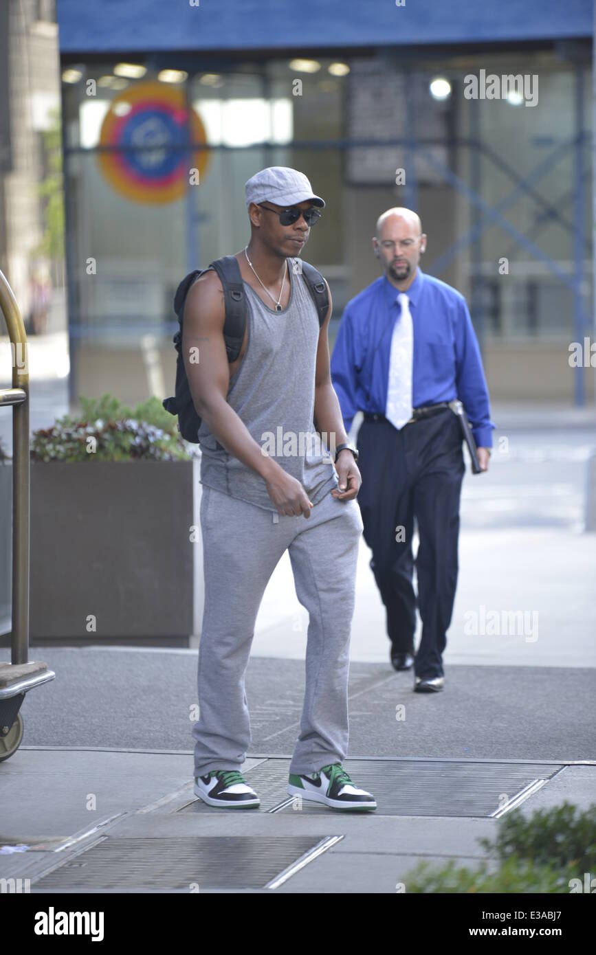 Comedian Dave Chappelle leaving his hotel wearing a backpack Featuring ...