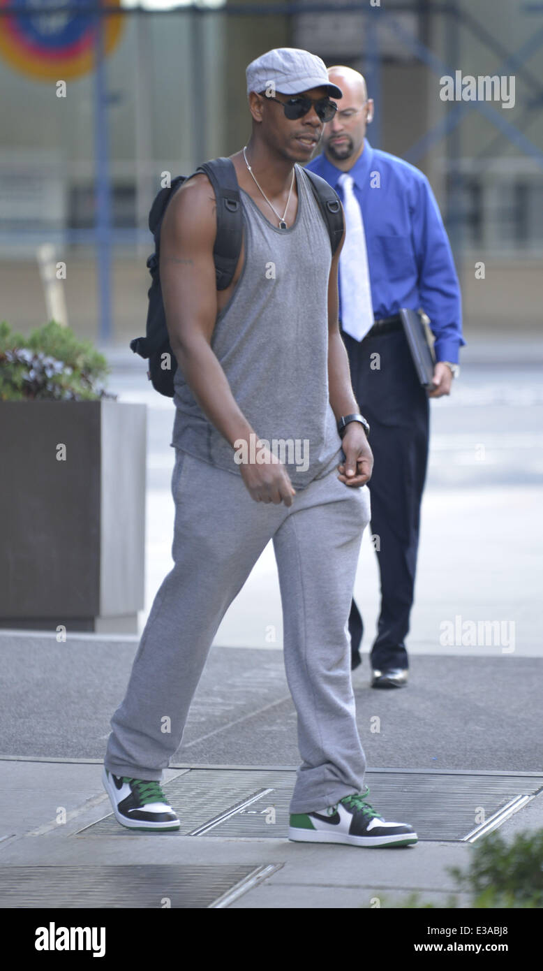 Comedian Dave Chappelle leaving his hotel wearing a backpack Featuring ...