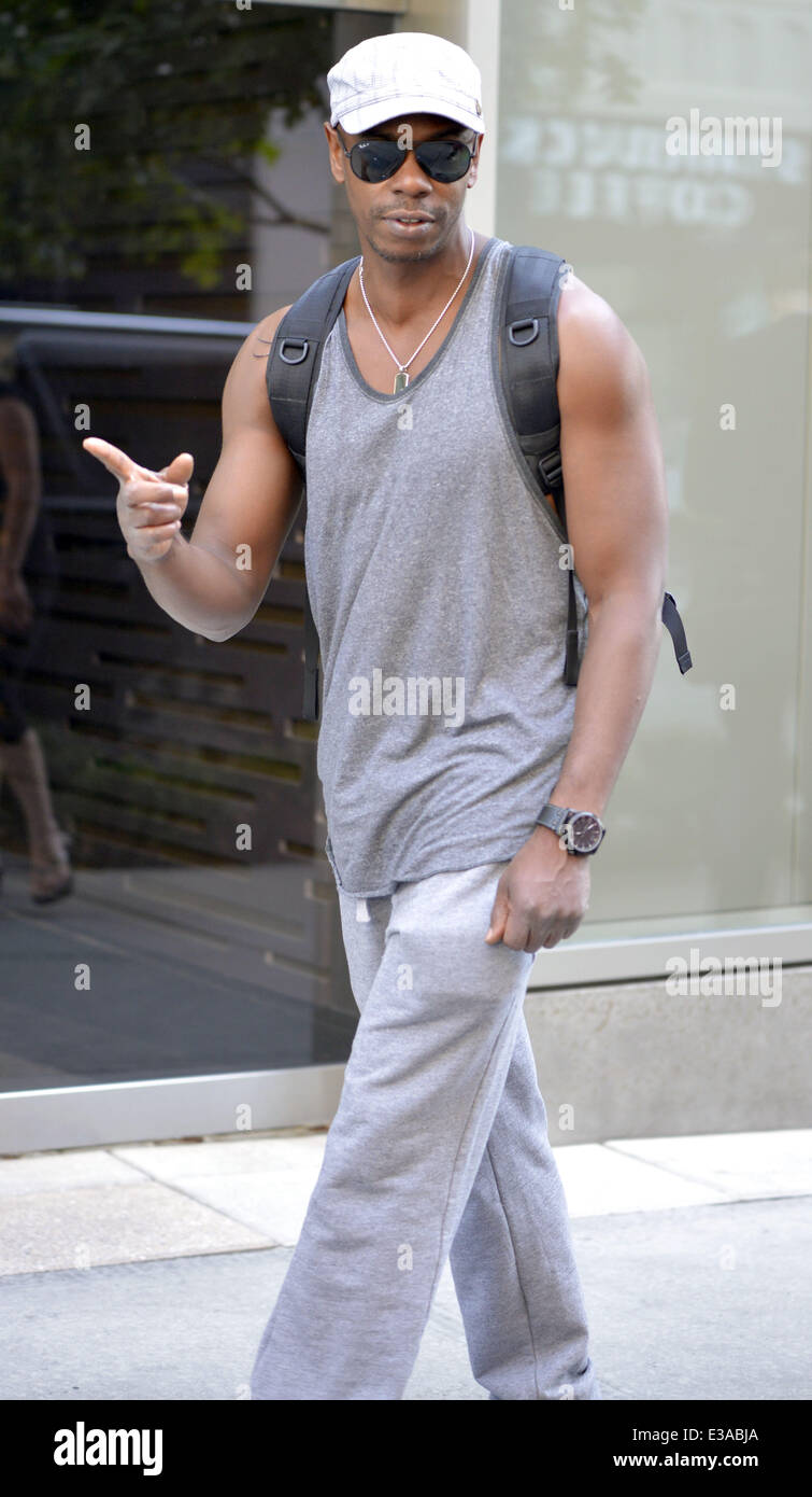 Comedian Dave Chappelle leaving his hotel wearing a backpack Featuring ...