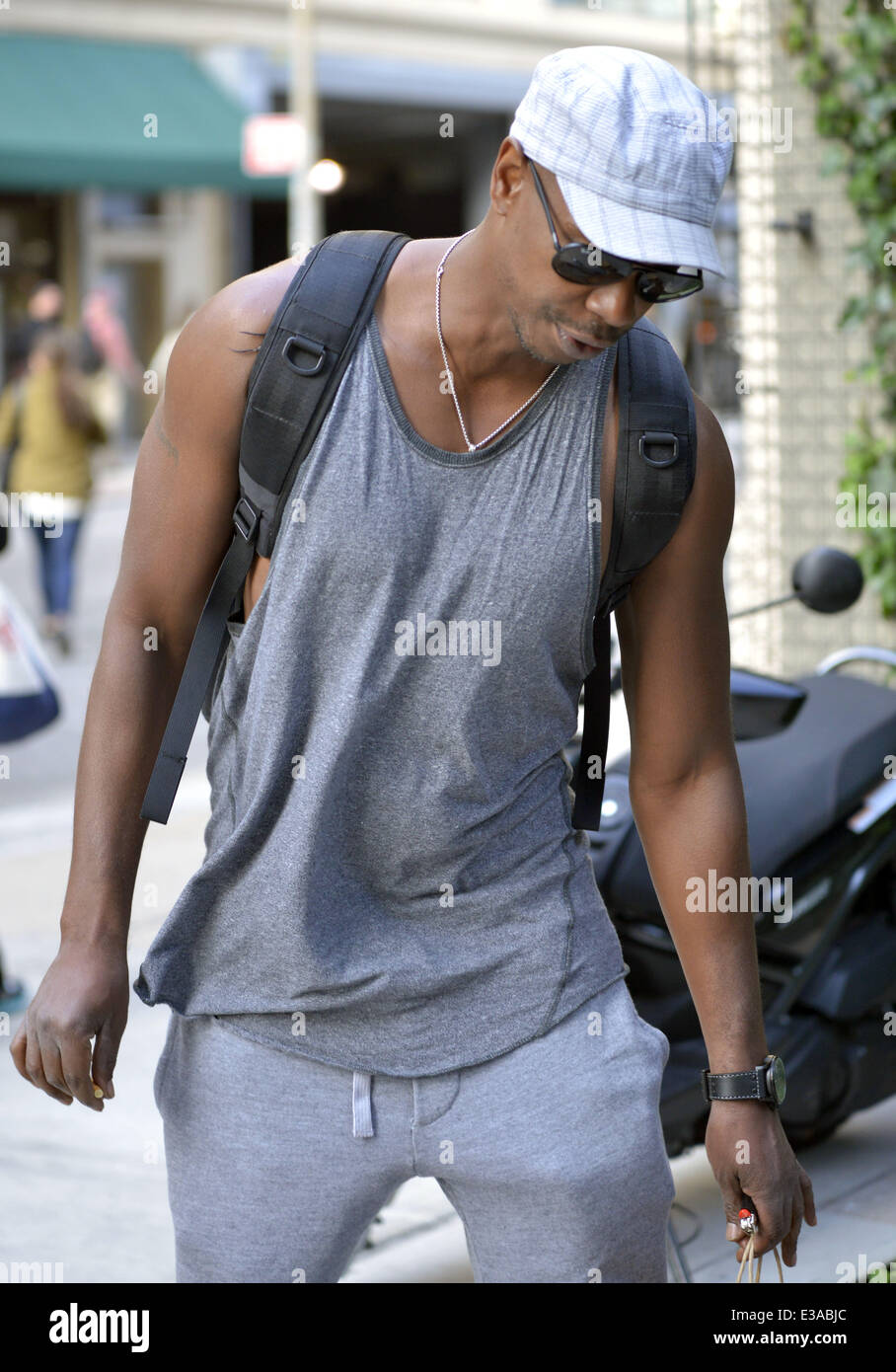 Comedian Dave Chappelle leaving his hotel wearing a backpack Featuring ...