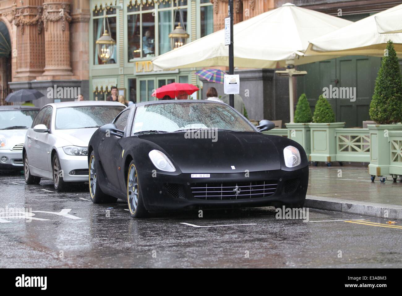 A velvet covered Ferrari seen parked at the rear of Harrods in ...