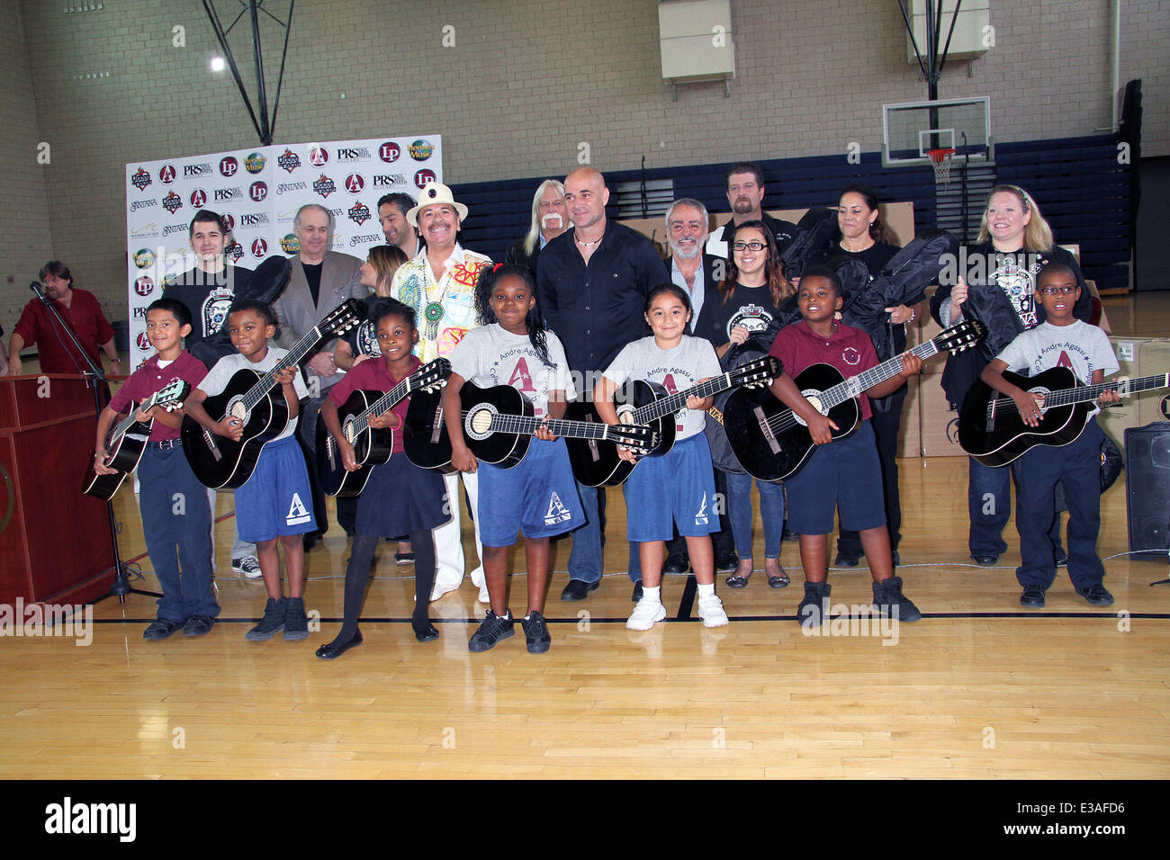 ANDRE AGASSI Joins CARLOS SANTANA For Musical Instrument Donation At ...