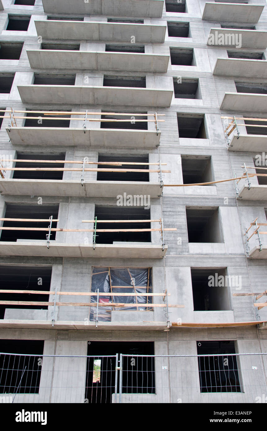 new building house wall construction with windows hole in work place ...