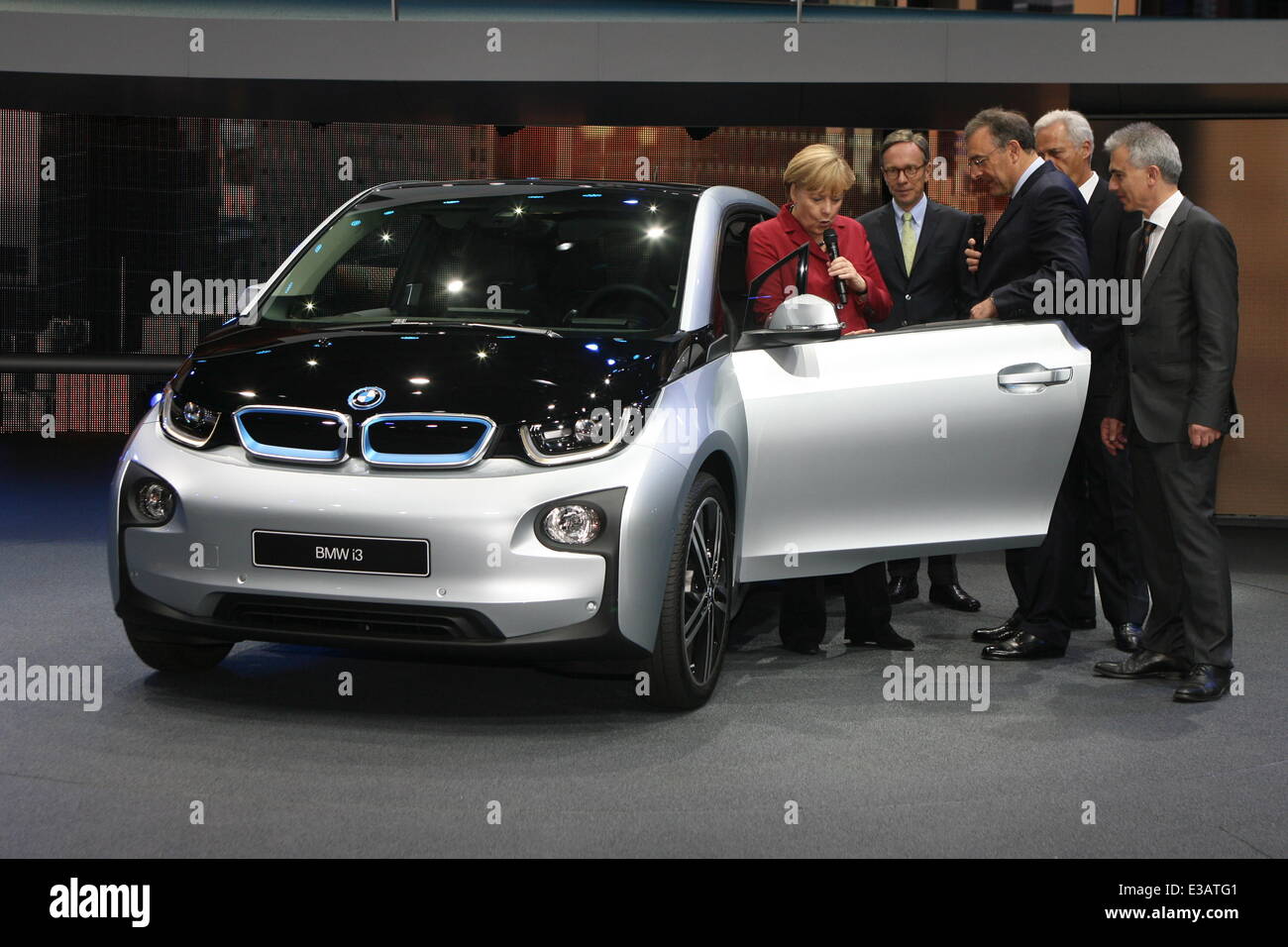 German Chancellor Angela Merkel looks at the Opel Monza concept car at ...