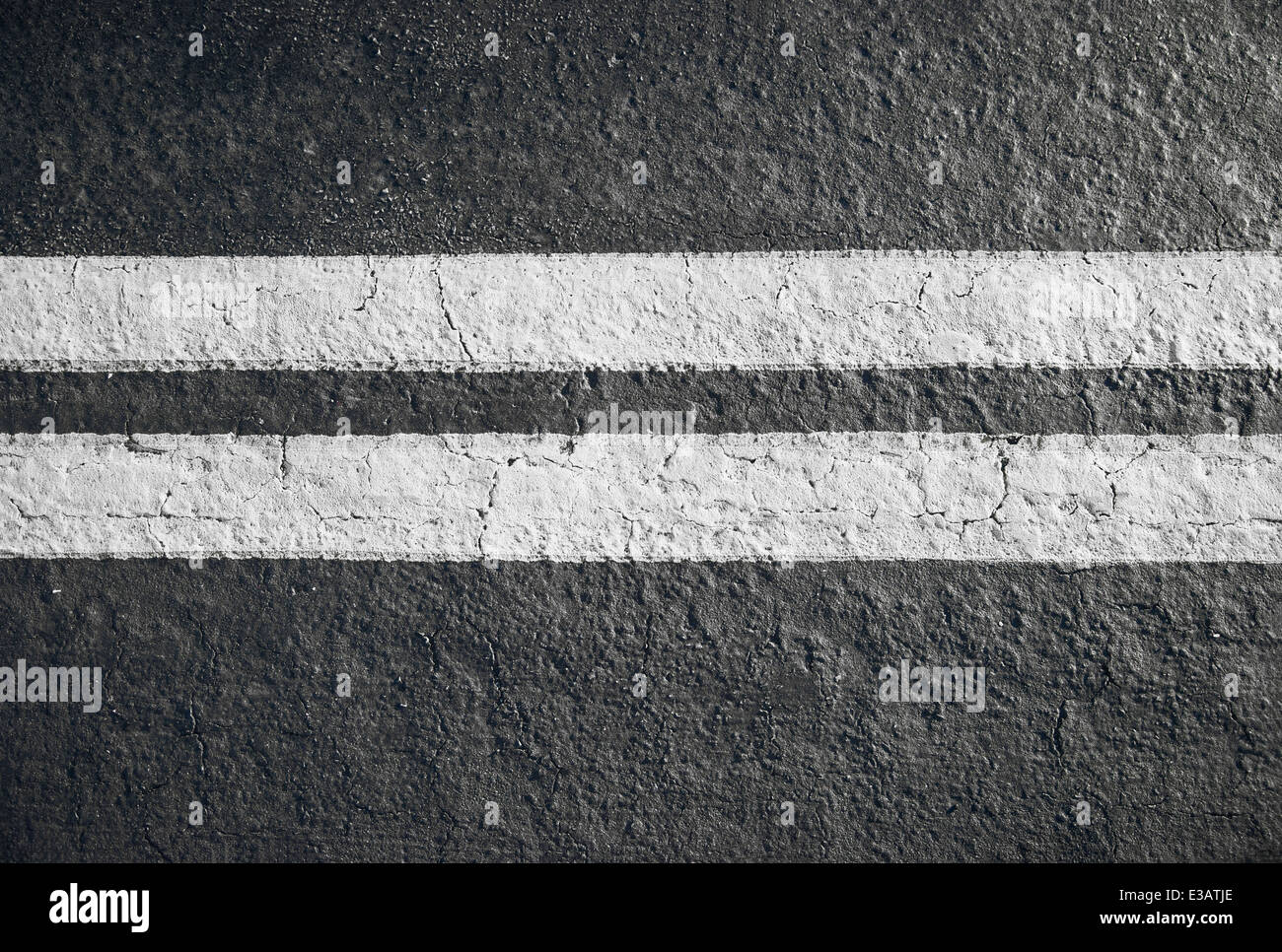double white lines divider on blacktop horizontal Stock Photo - Alamy