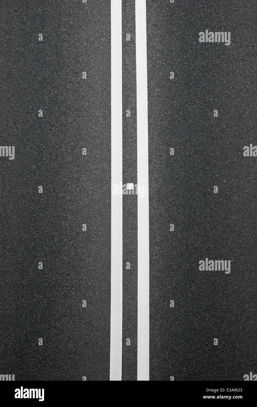 double white lines divider on blacktop vertical Stock Photo - Alamy