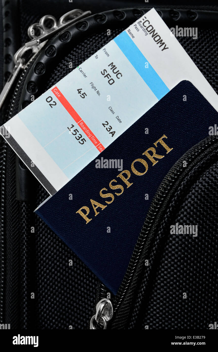 Passport with boarding pass in a suitcase Stock Photo - Alamy