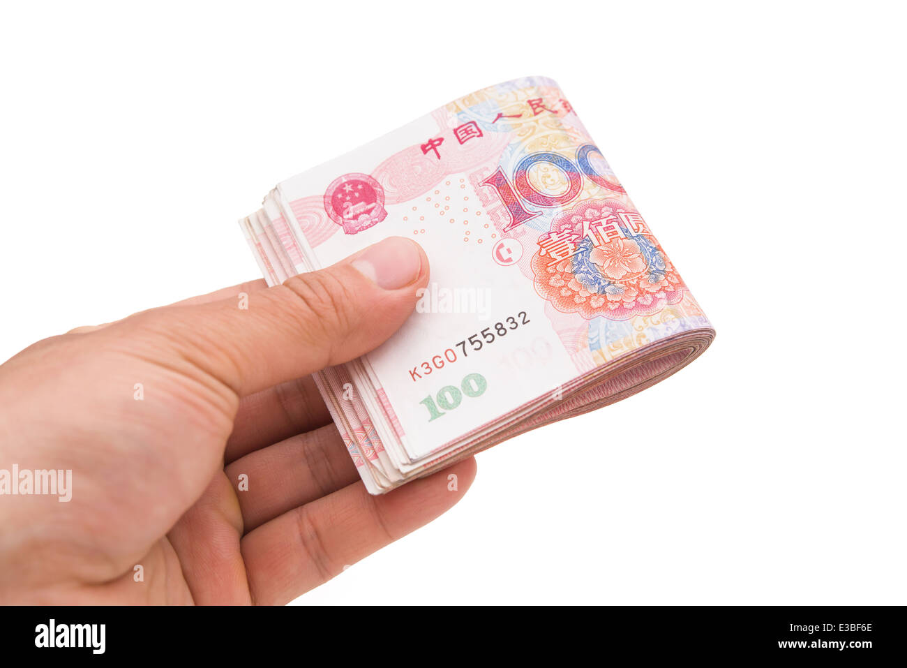 hand holding stack or RMB with clipping path Stock Photo - Alamy