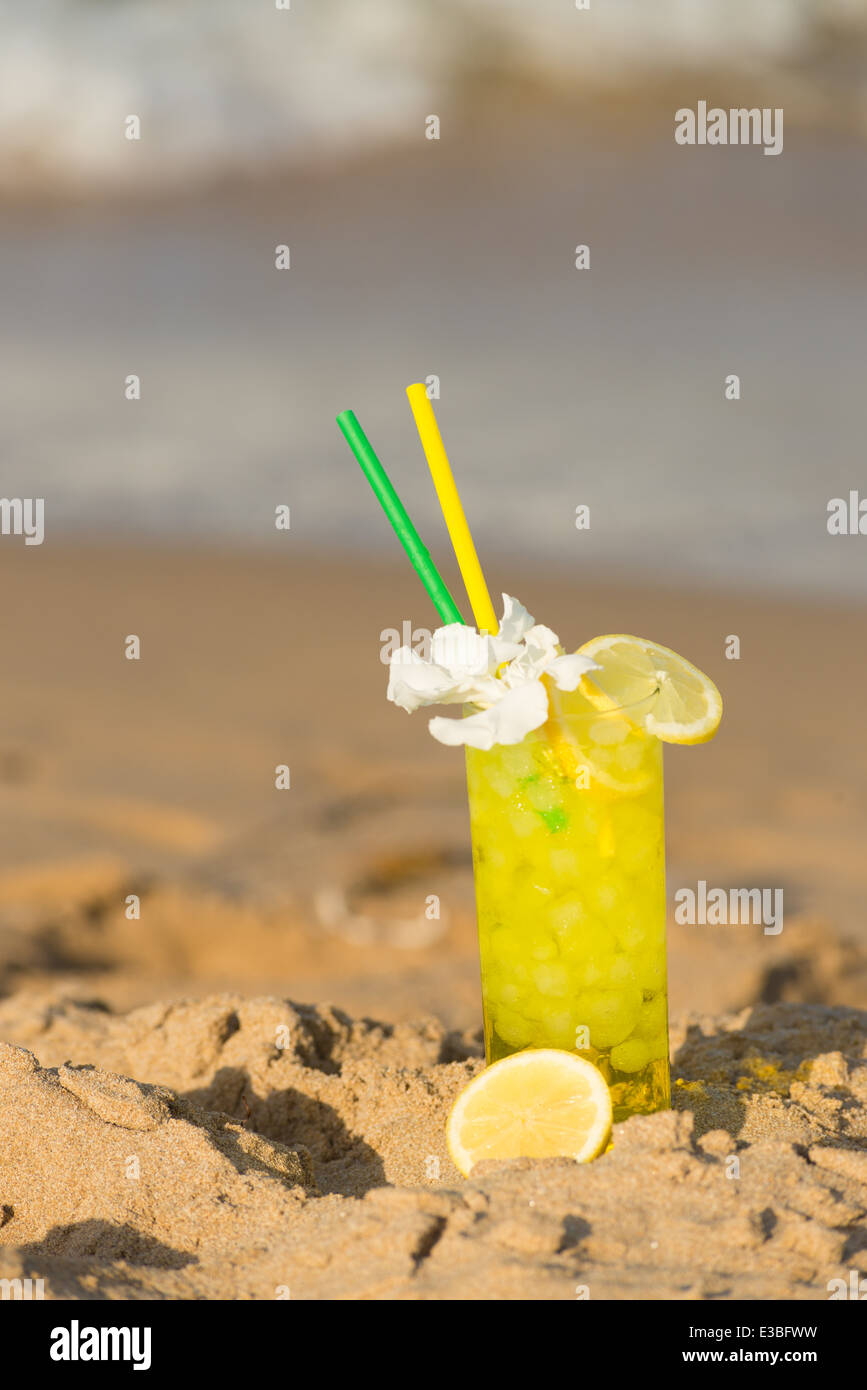 A chilled lemon cocktail on a sunny beach Stock Photo - Alamy