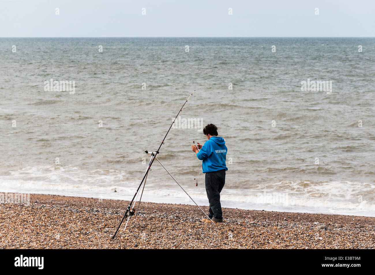 An angler on Cley Beach Stock Photo - Alamy