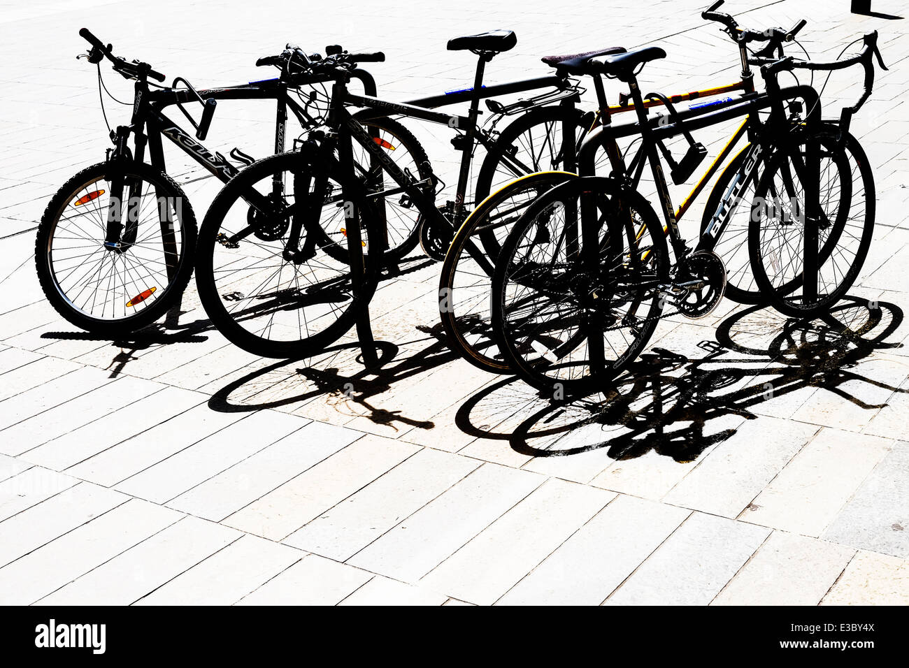 Bicycles in a bicycle rack Stock Photo - Alamy
