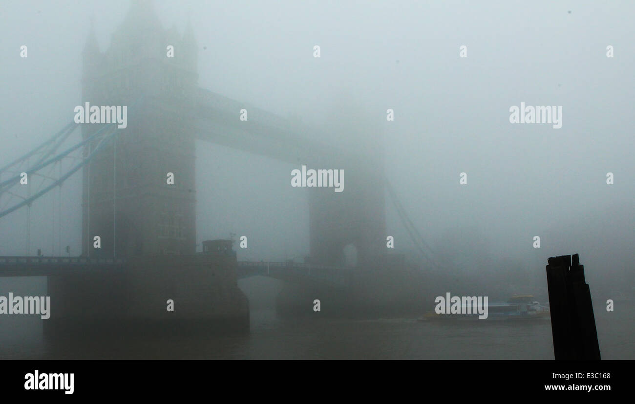 Tower Bridge is shrouded in thick fog Featuring: View Where: London ...