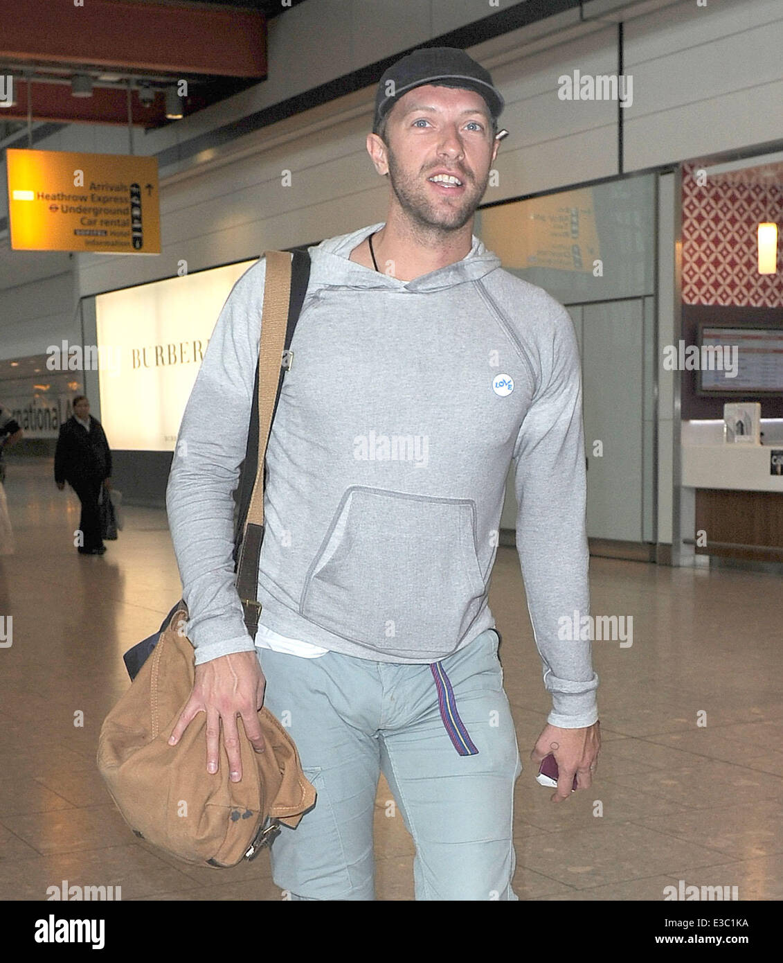 Chris Martin arriving at Heathrow Airport on a flight from Los Angeles ...