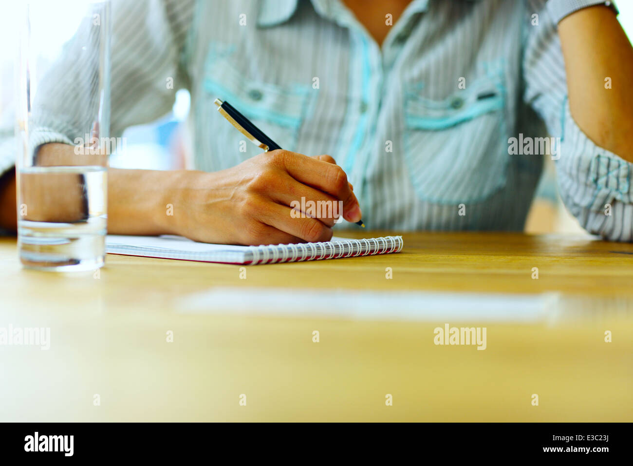 Closeup portrait of a female hand writing on a paper Stock Photo - Alamy