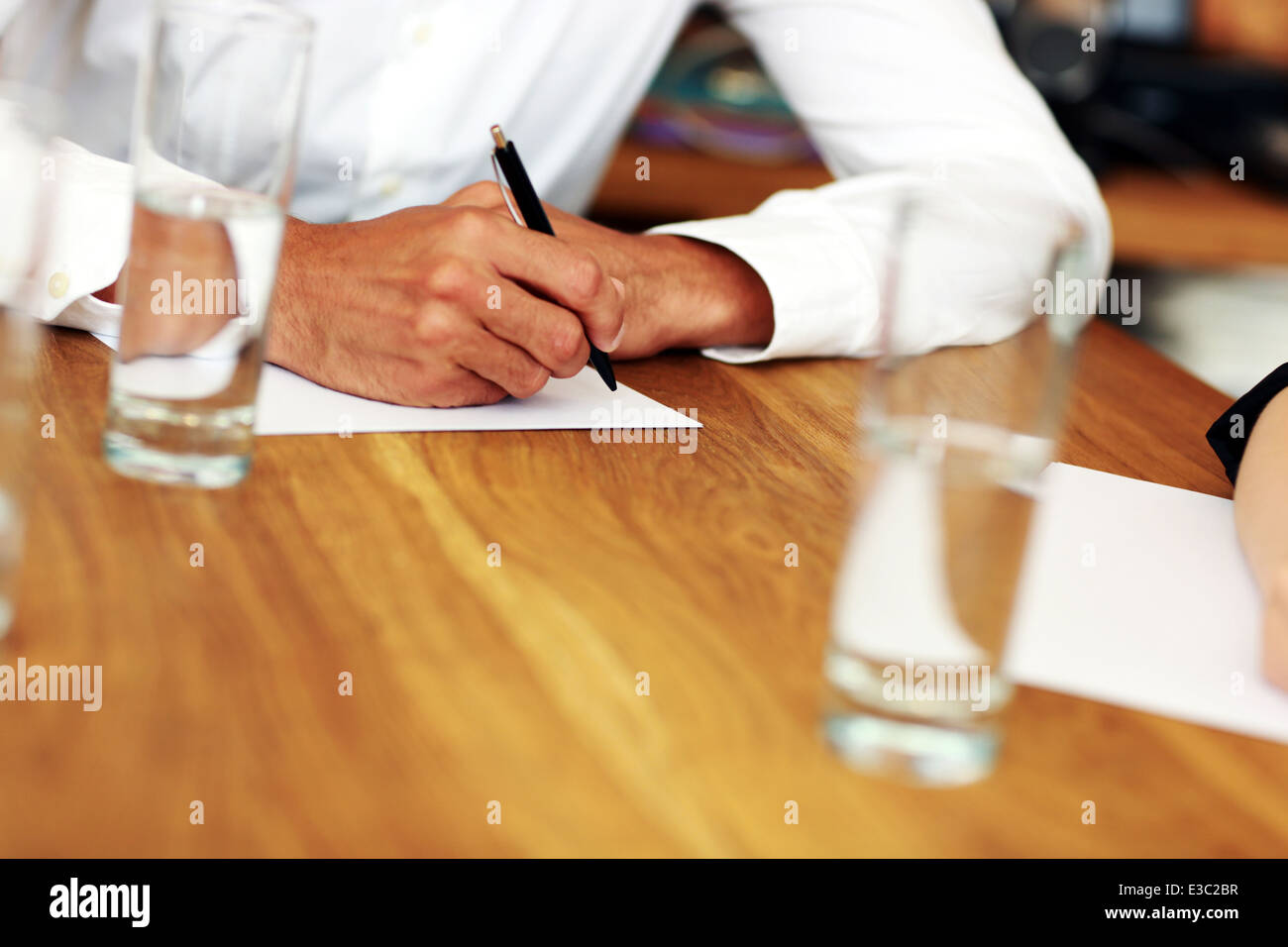 Closeup portrait of a male hand writing on a paper Stock Photo - Alamy