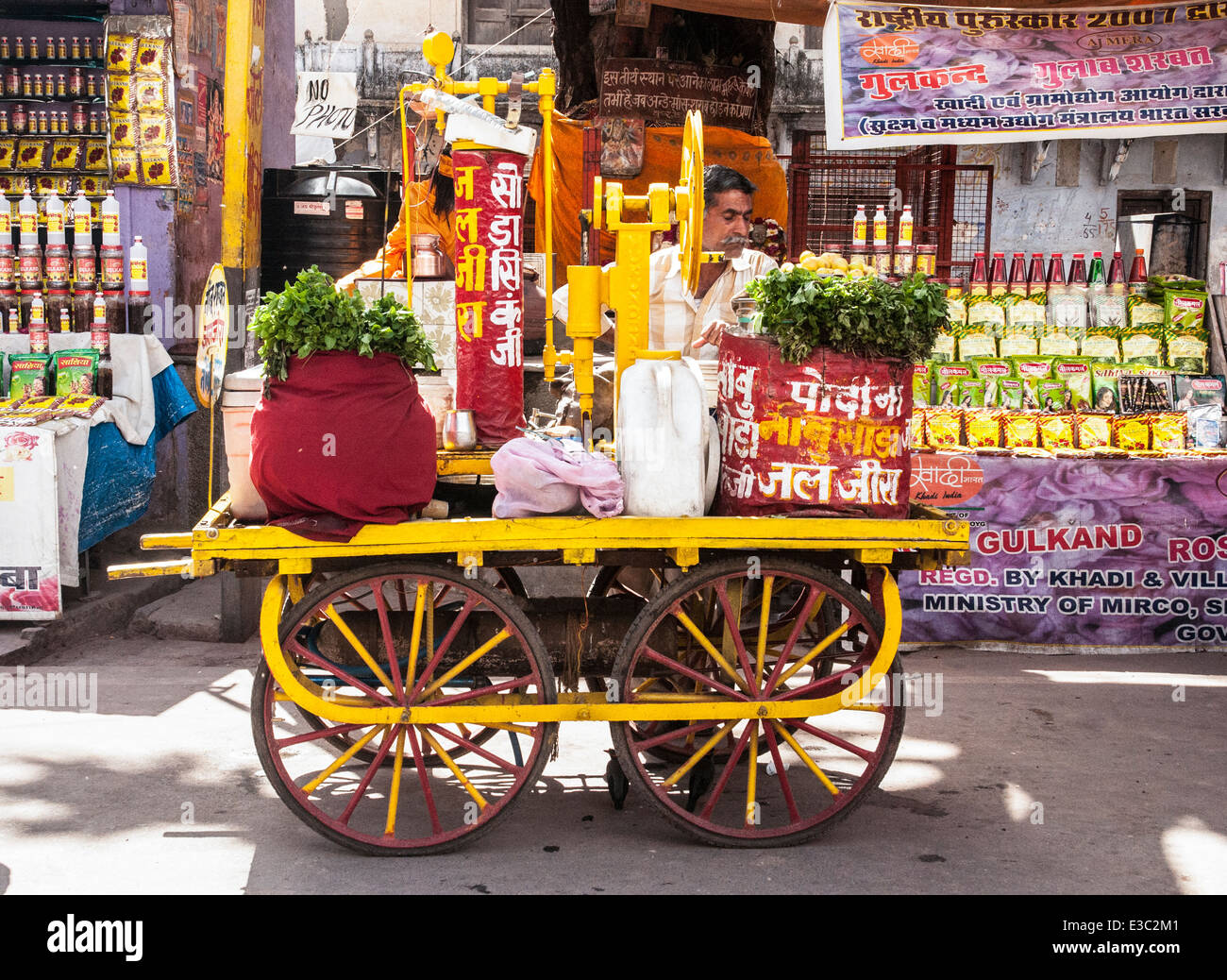 Street vendor sells Indian food off a street stall. Photographed in ...
