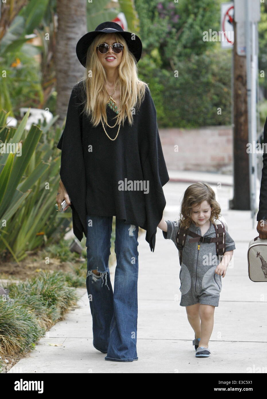 Rachel Zoe wearing flared jeans, out and about with her son Skyler in ...