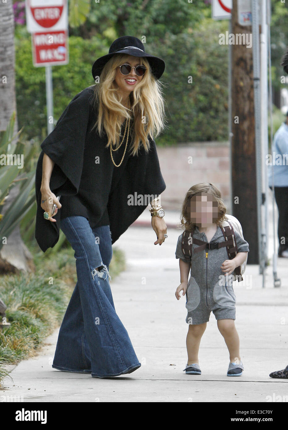 Rachel Zoe wearing flared jeans, out and about with her son Skyler in ...