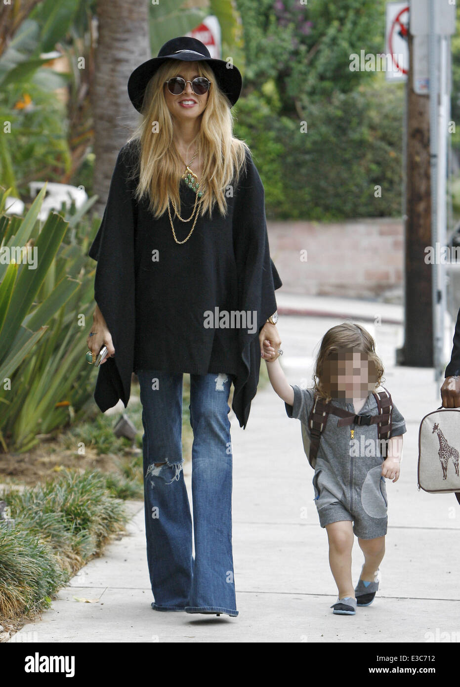 Rachel Zoe wearing flared jeans, out and about with her son Skyler in ...