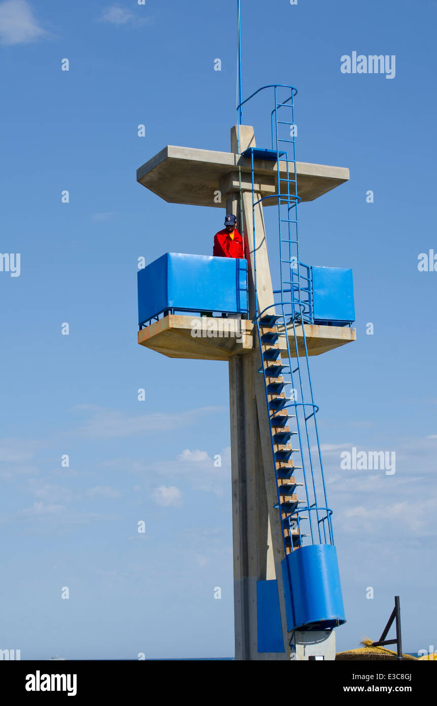 Concrete lifeguard watchtower over a Mediterranean beach, Torremolinos ...