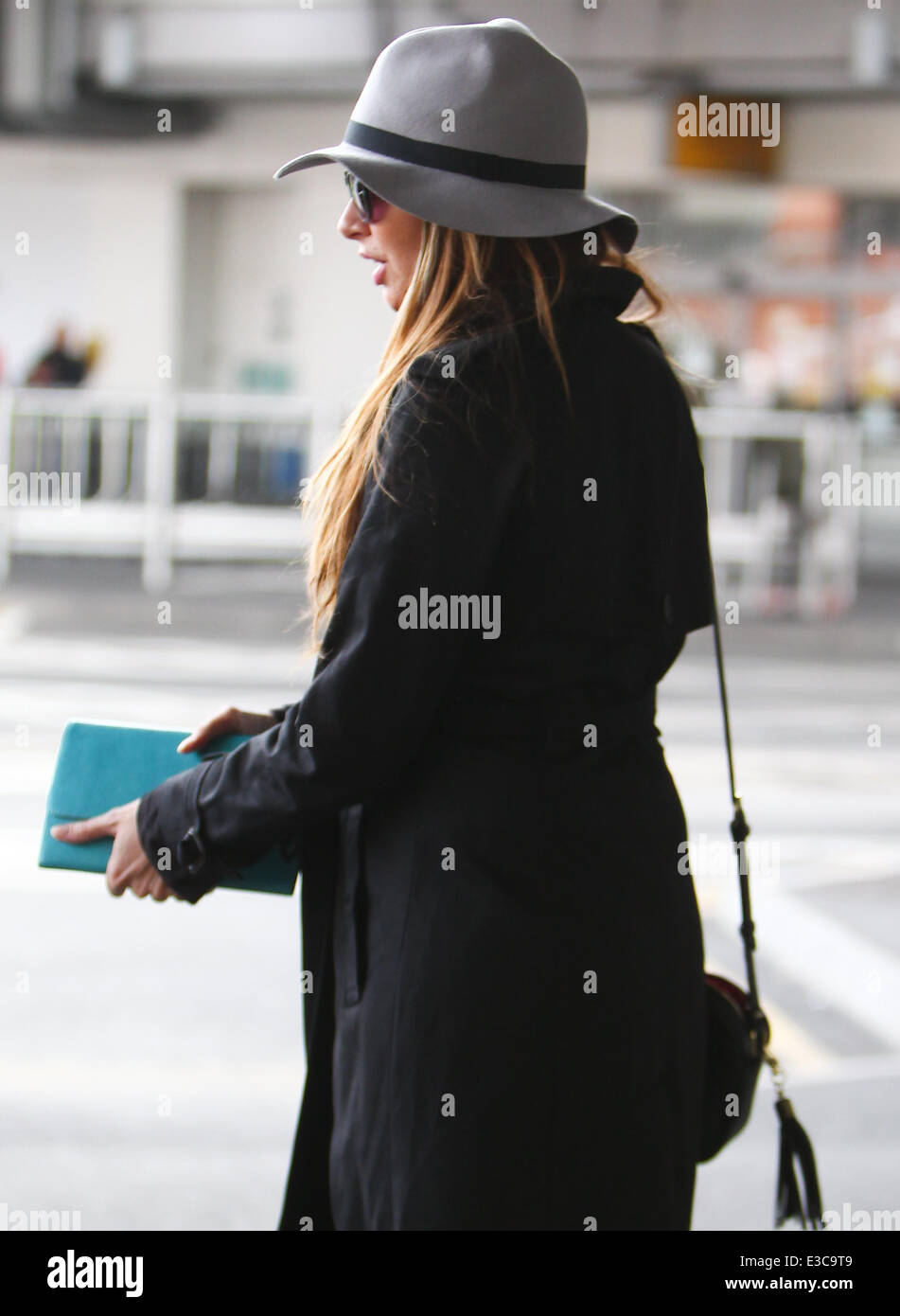 Nadine Coyle and boyfriend Jason Bell arrive at Heathrow airport ...