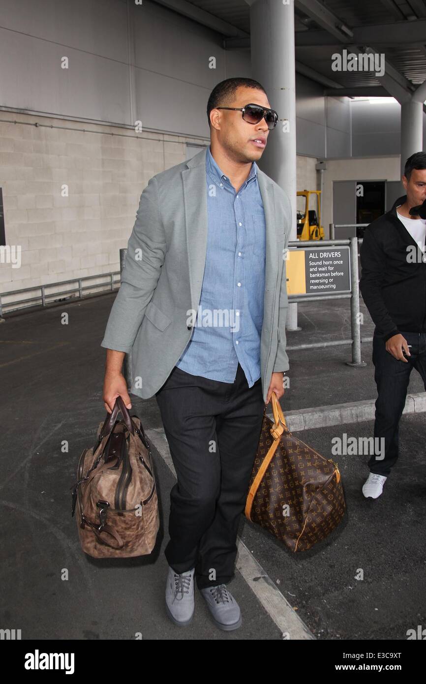 Pregnant Nadine Coyle arrives in London with her partner Jason Bell ...