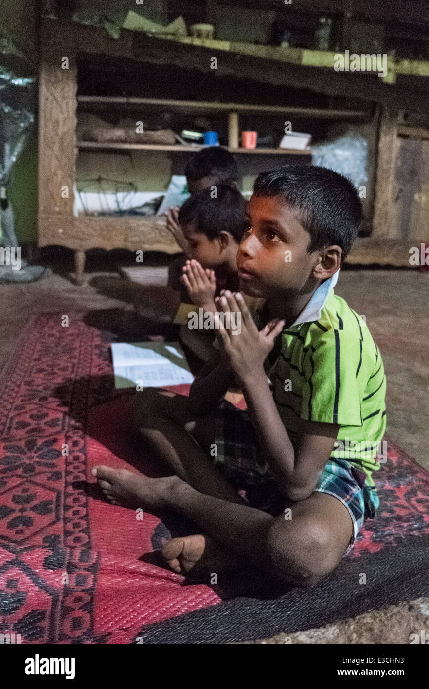 Boys praying hi-res stock photography and images - Alamy