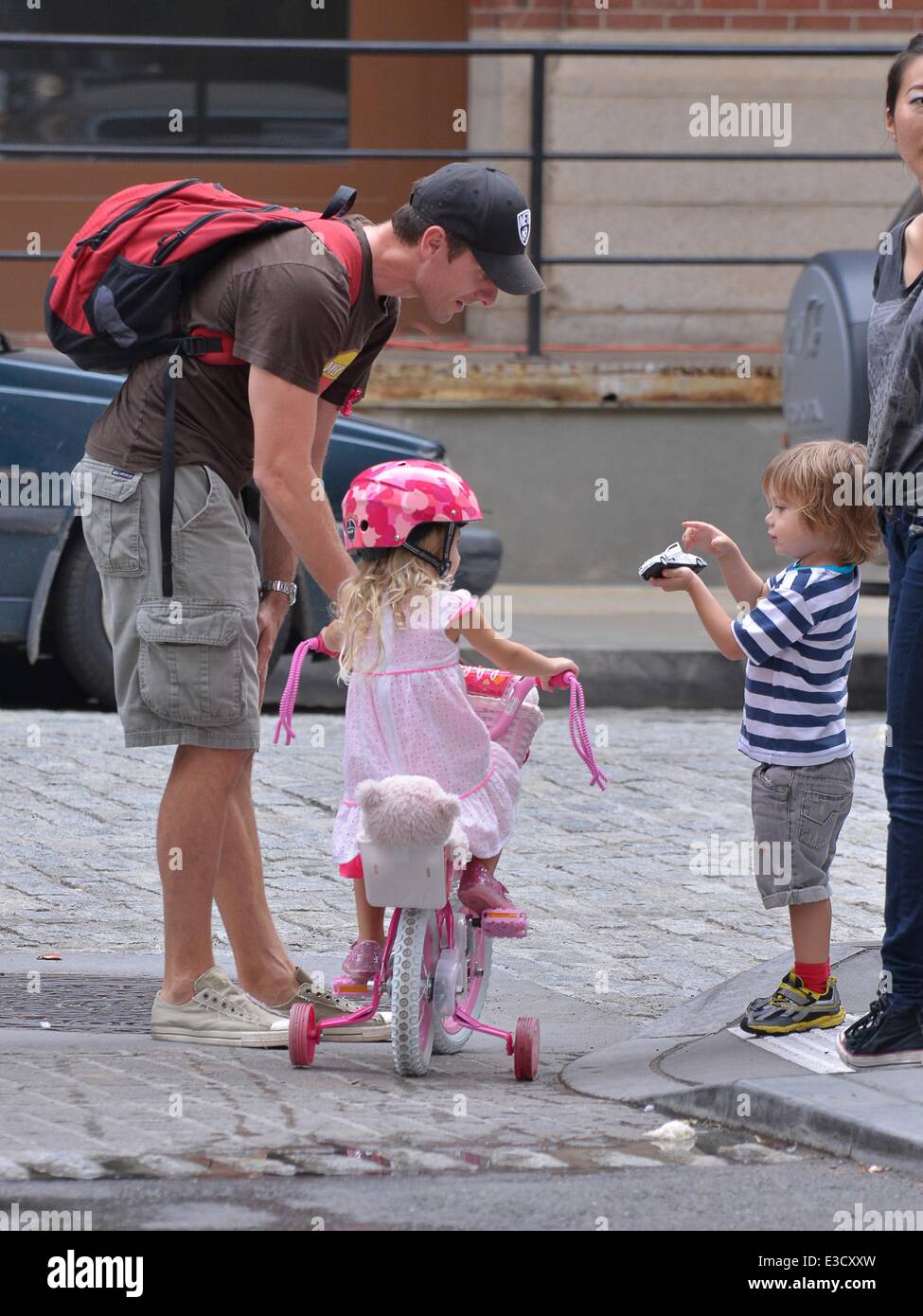 Jason Hoppy takes his daughter Bryne Hoppy for a bike ride on her pink ...