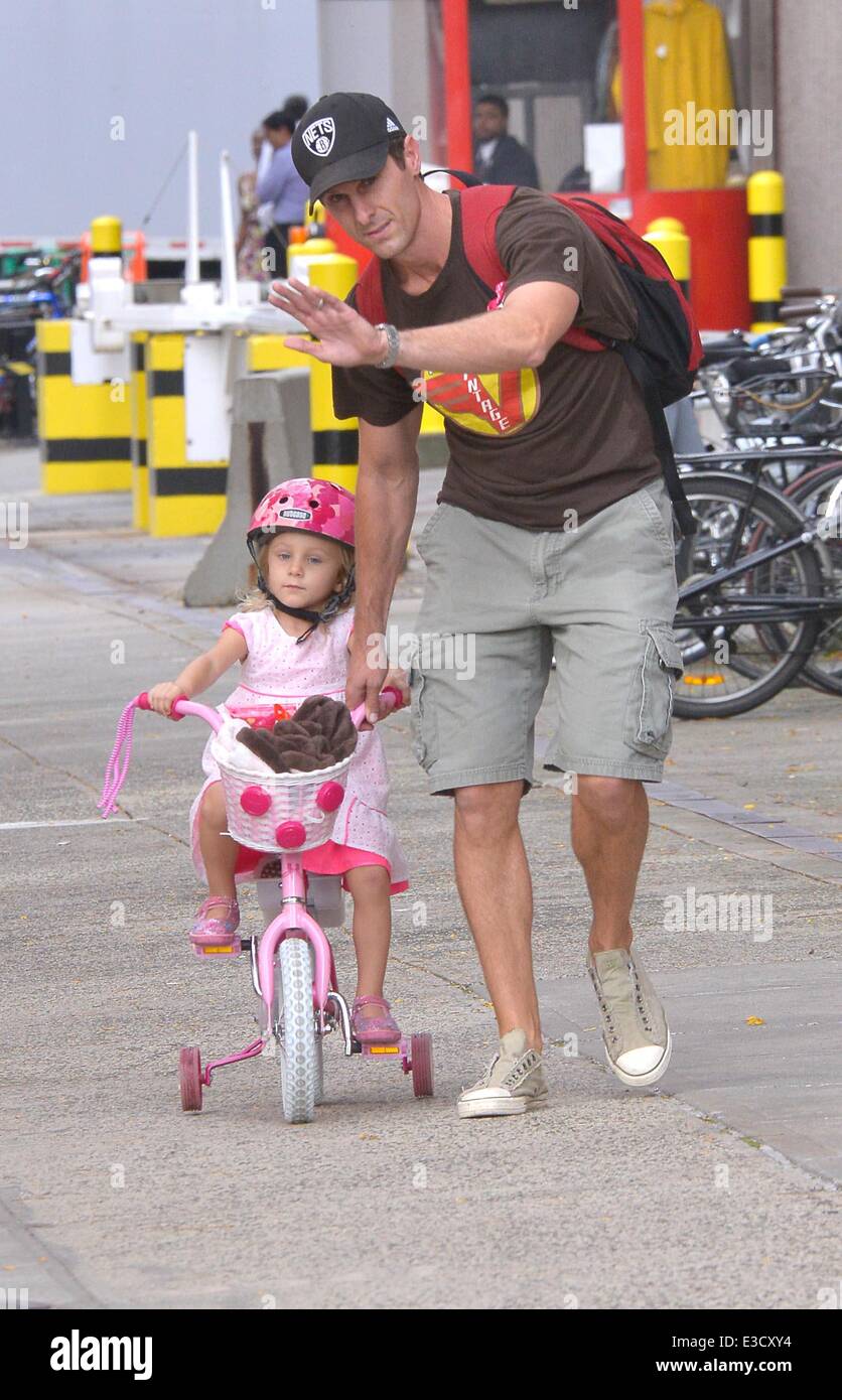 Jason Hoppy takes his daughter Bryne Hoppy for a bike ride on her pink ...
