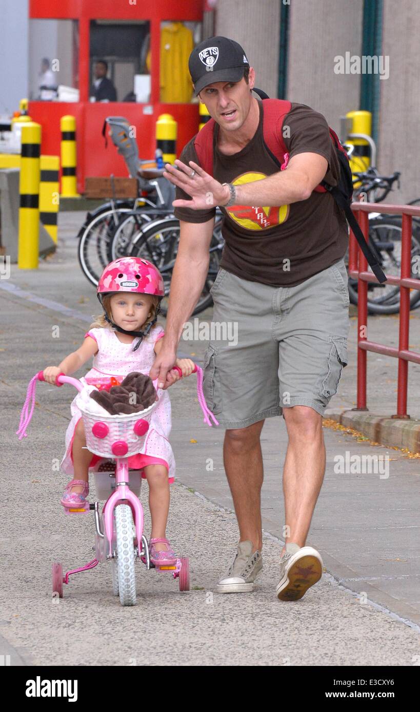 Jason Hoppy takes his daughter Bryne Hoppy for a bike ride on her pink ...