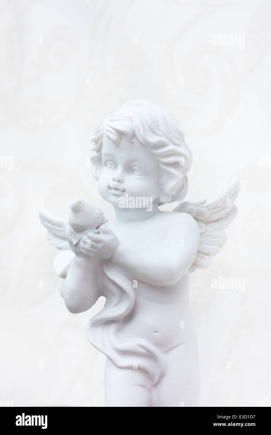 Angel dove angel holding a dove bird statue figurine hi-res stock ...