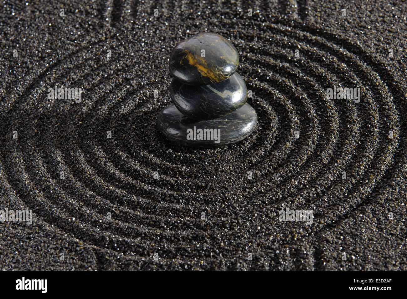 Japanese garden with stacked stones in sand Stock Photo - Alamy