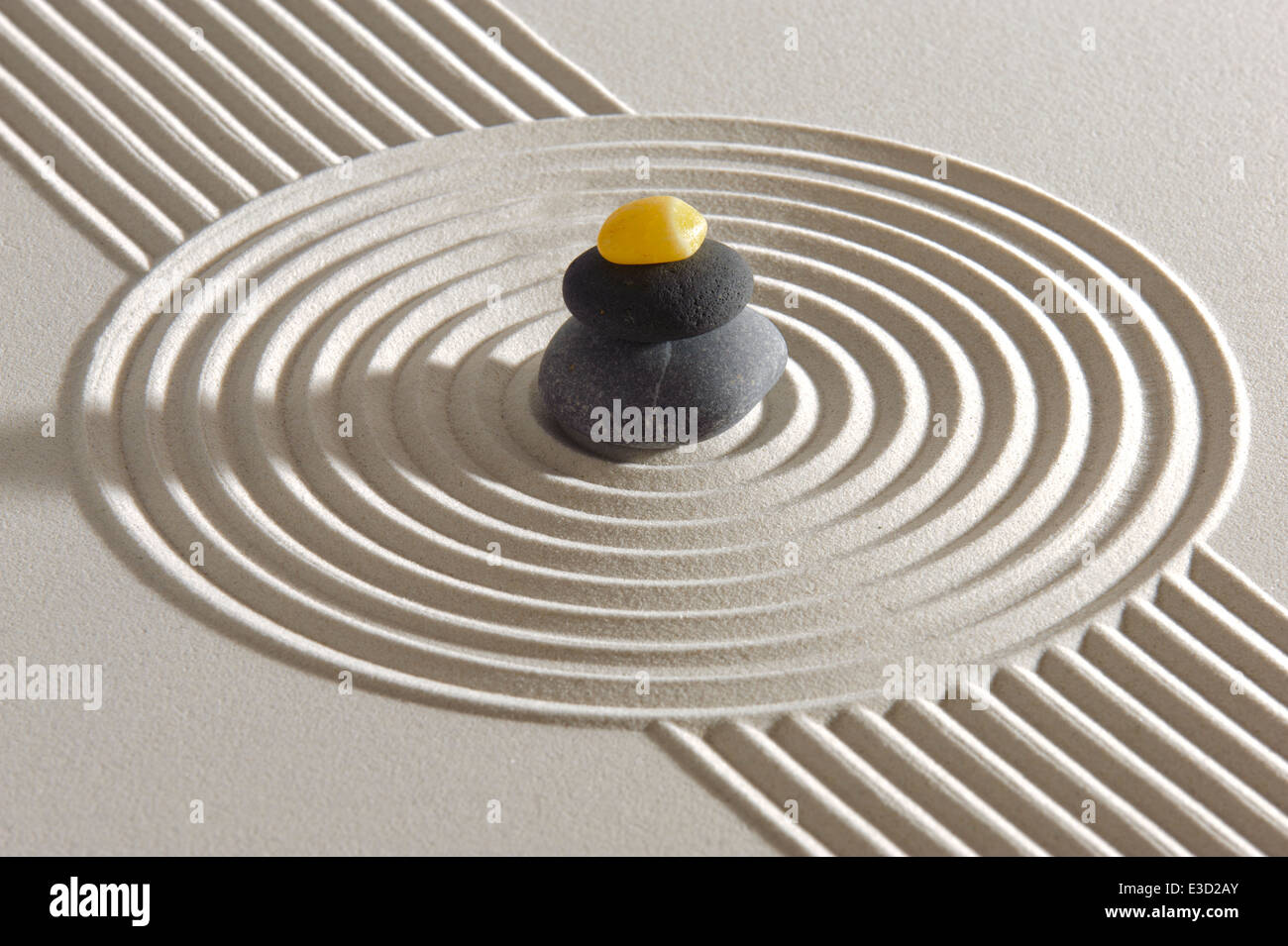 Japanese garden with stacked stones in sand Stock Photo - Alamy