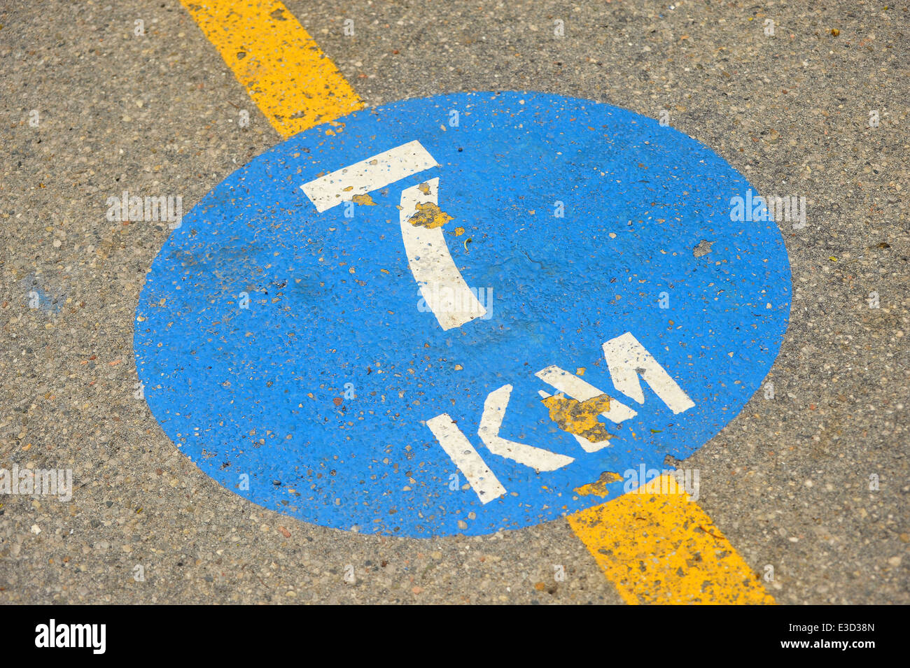 A distance marker sign painted on a cycle path in London, Ontario Stock ...