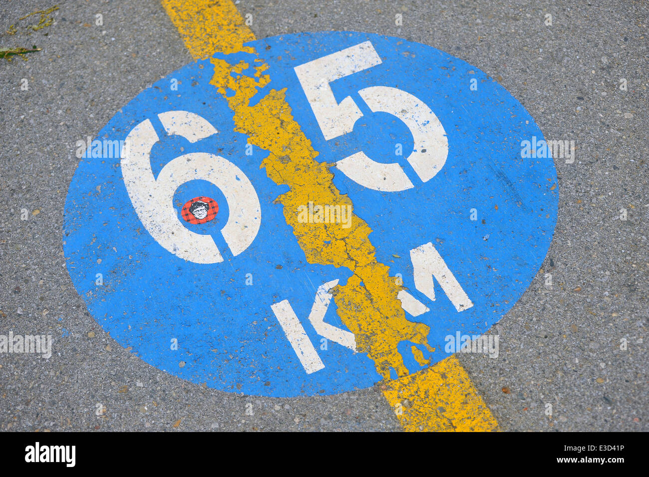 A distance marker sign painted on a cycle path in London, Ontario Stock ...
