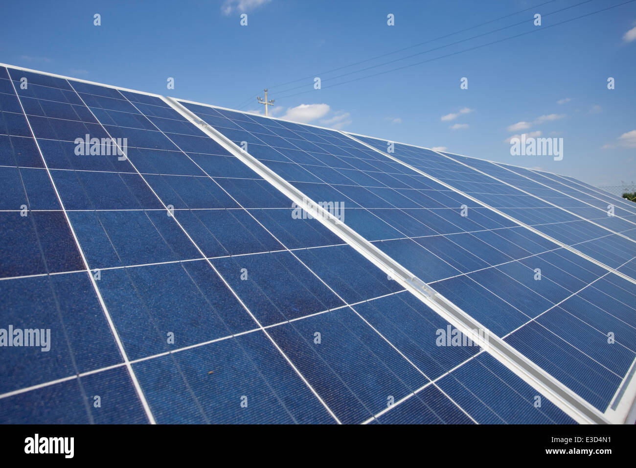 Ecology electric energy farm with solar panel battery in green field ...