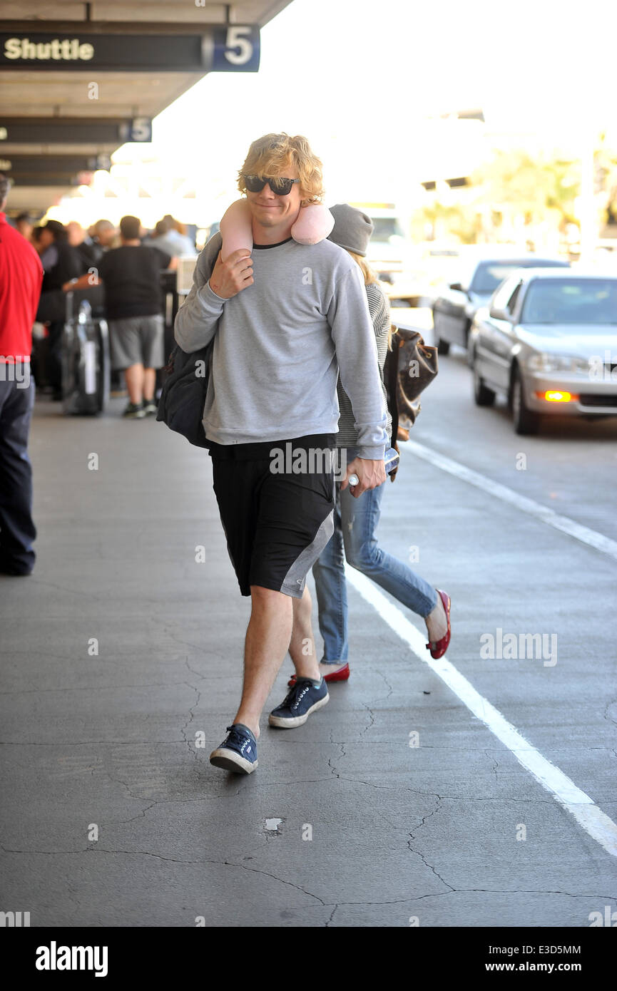 Emma Roberts and her boyfriend Evan Peters pack on the PDA at LAX as they catch a flight out of ...