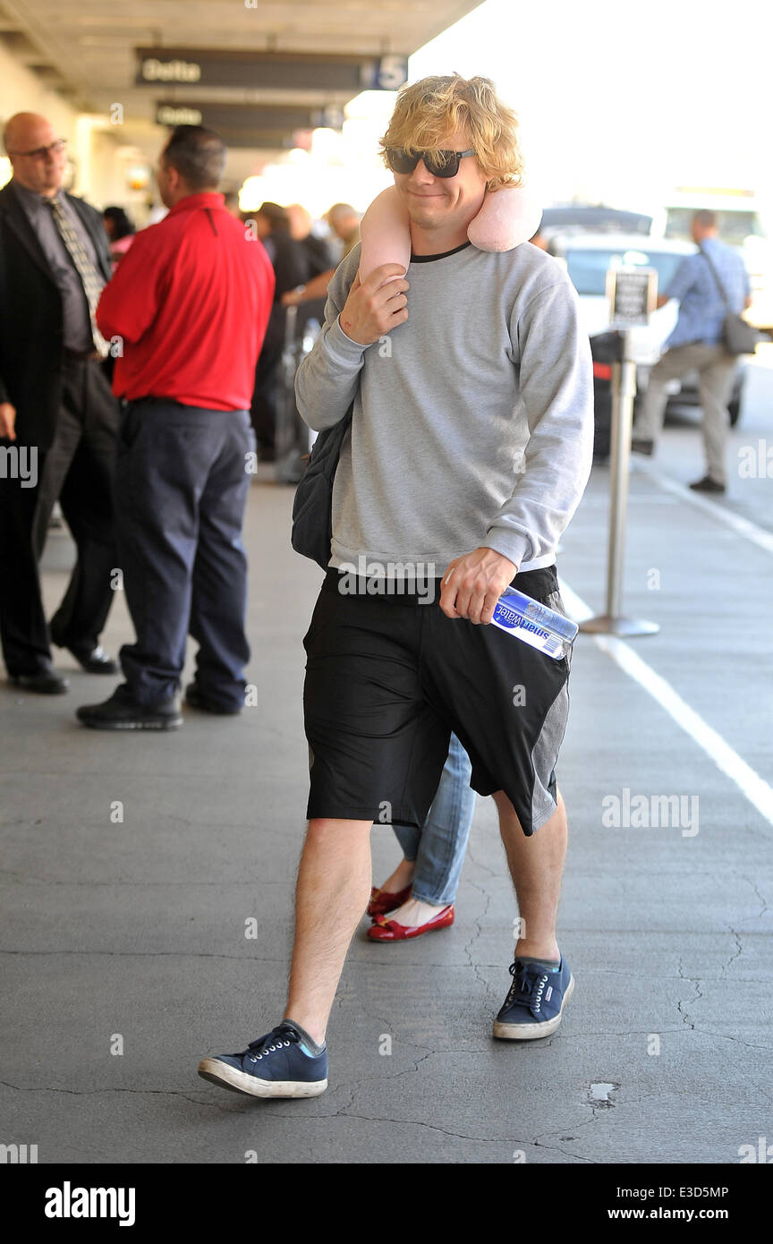 Emma Roberts and her boyfriend Evan Peters pack on the PDA at LAX as they catch a flight out of ...