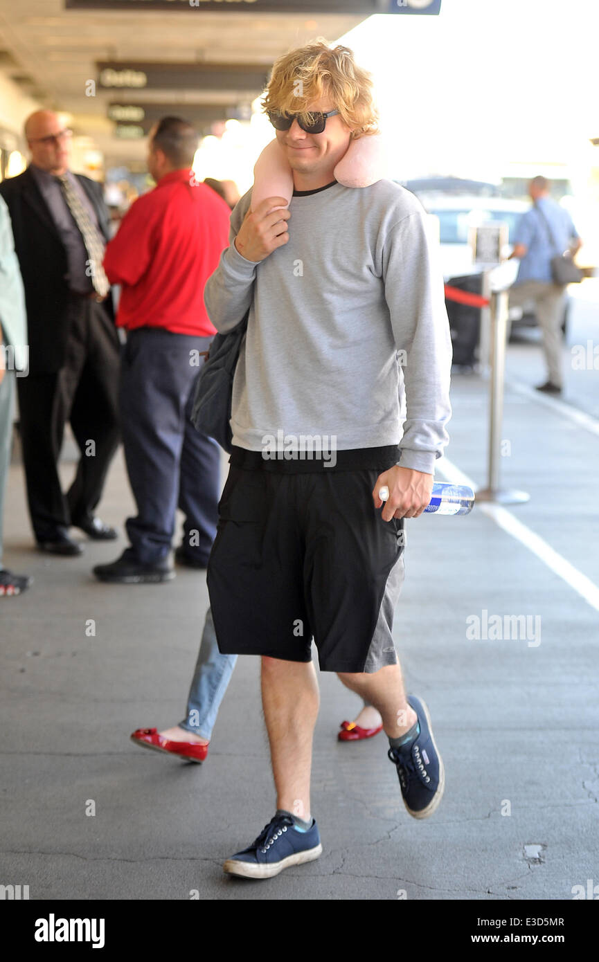 Emma Roberts and her boyfriend Evan Peters pack on the PDA at LAX as they catch a flight out of ...