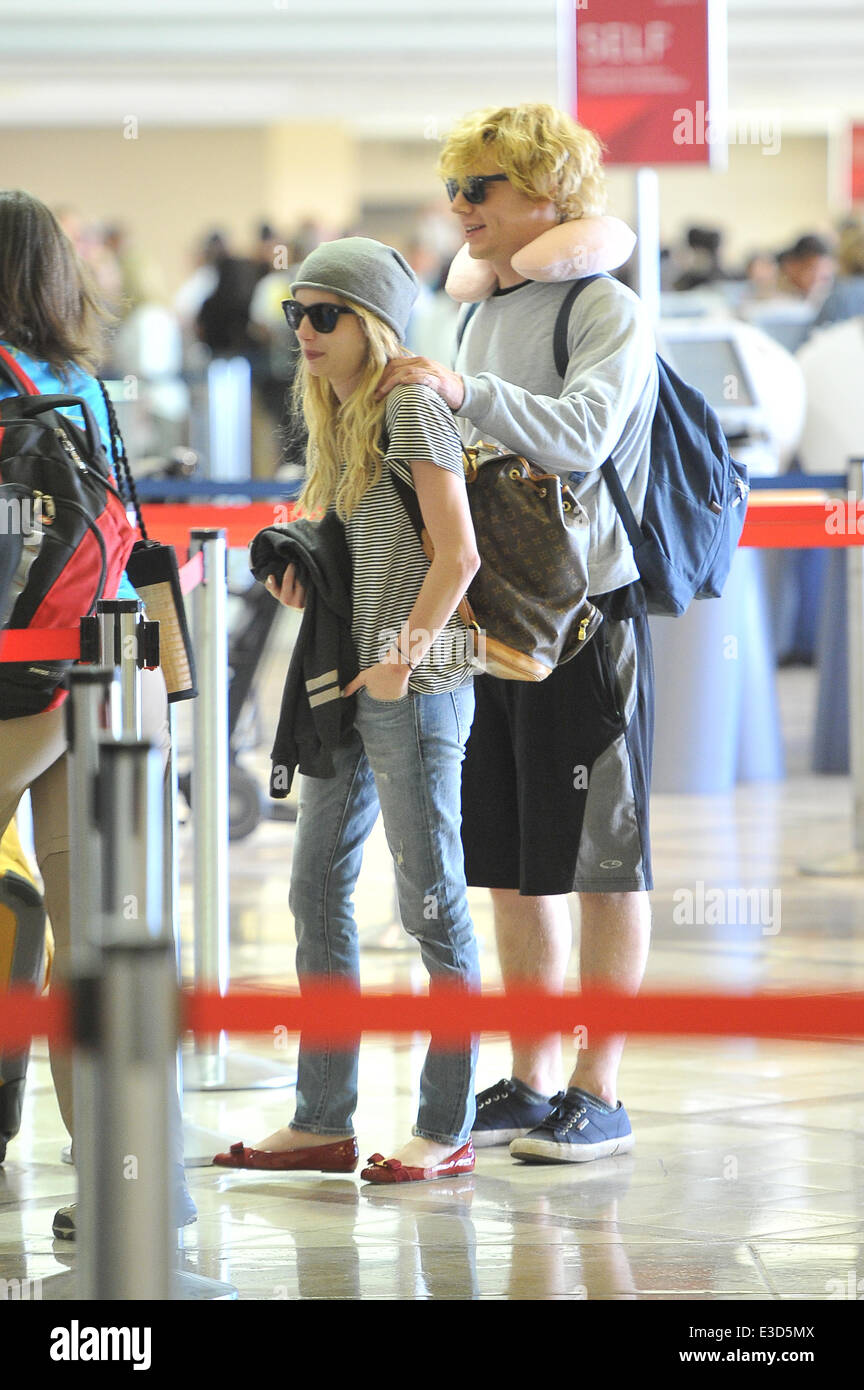 Emma Roberts and her boyfriend Evan Peters pack on the PDA at LAX as ...