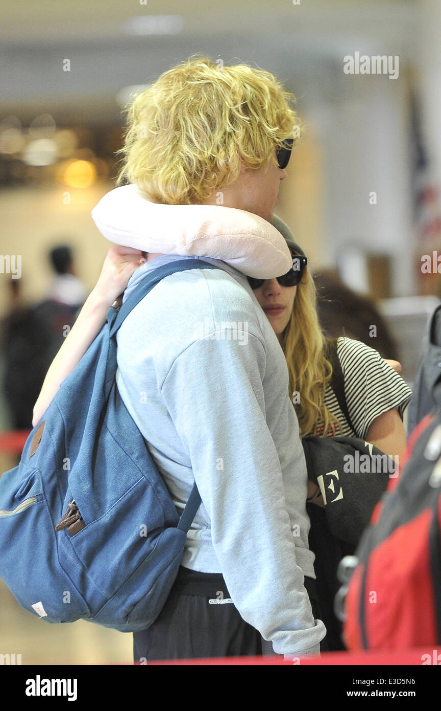 Emma Roberts and her boyfriend Evan Peters pack on the PDA at LAX as they catch a flight out of ...
