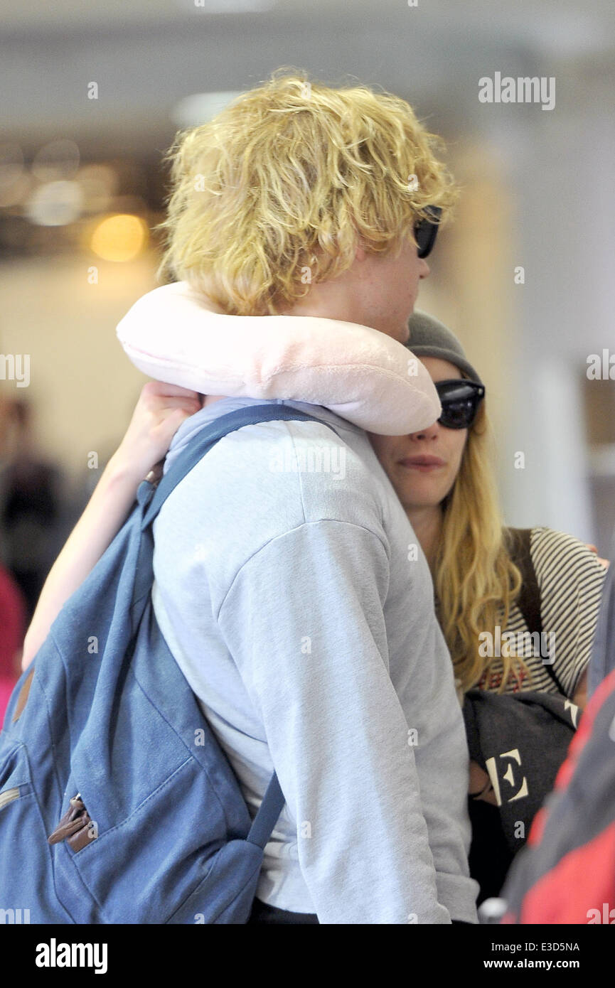 Emma Roberts and her boyfriend Evan Peters pack on the PDA at LAX as they catch a flight out of ...
