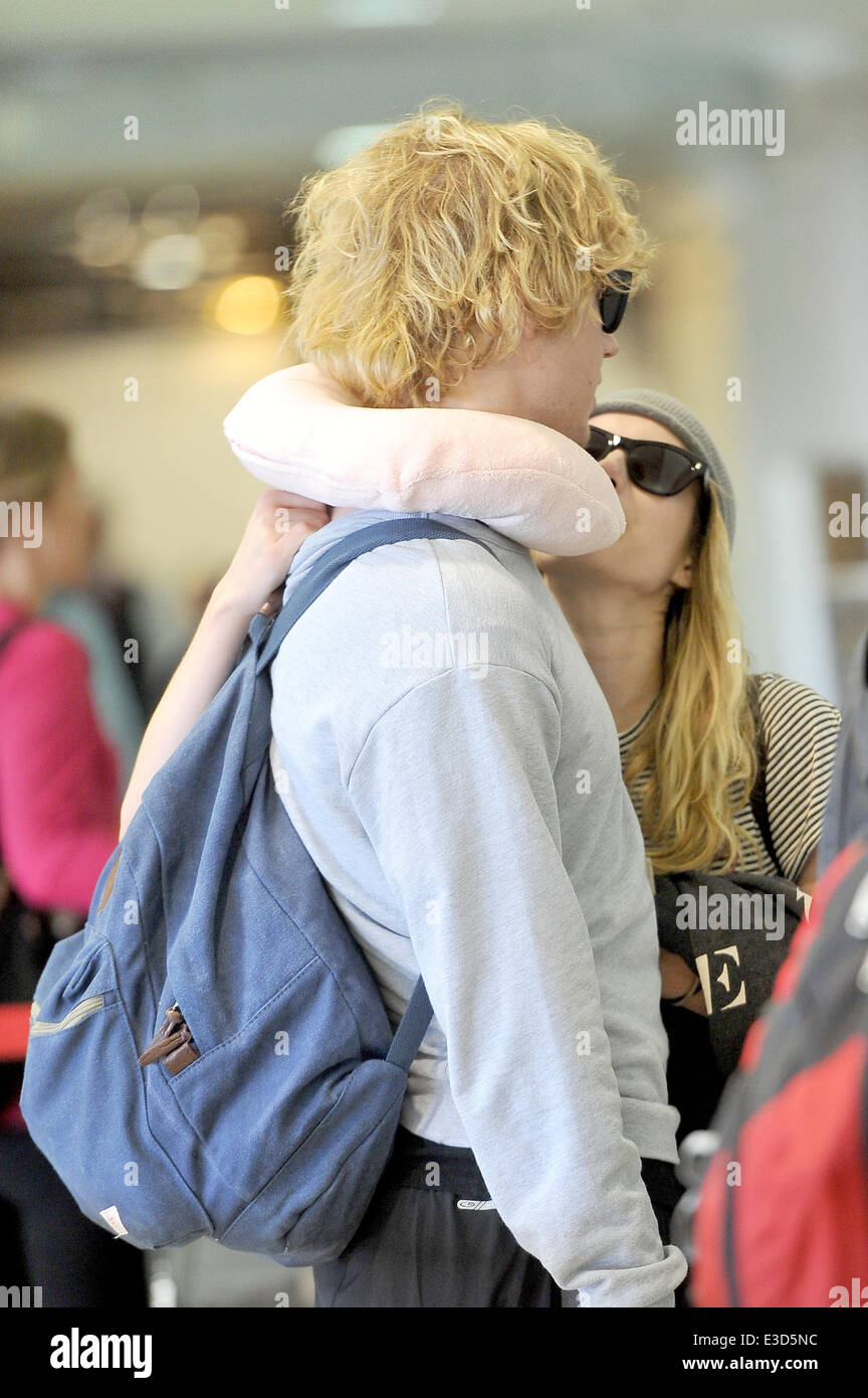 Emma Roberts and her boyfriend Evan Peters pack on the PDA at LAX as ...