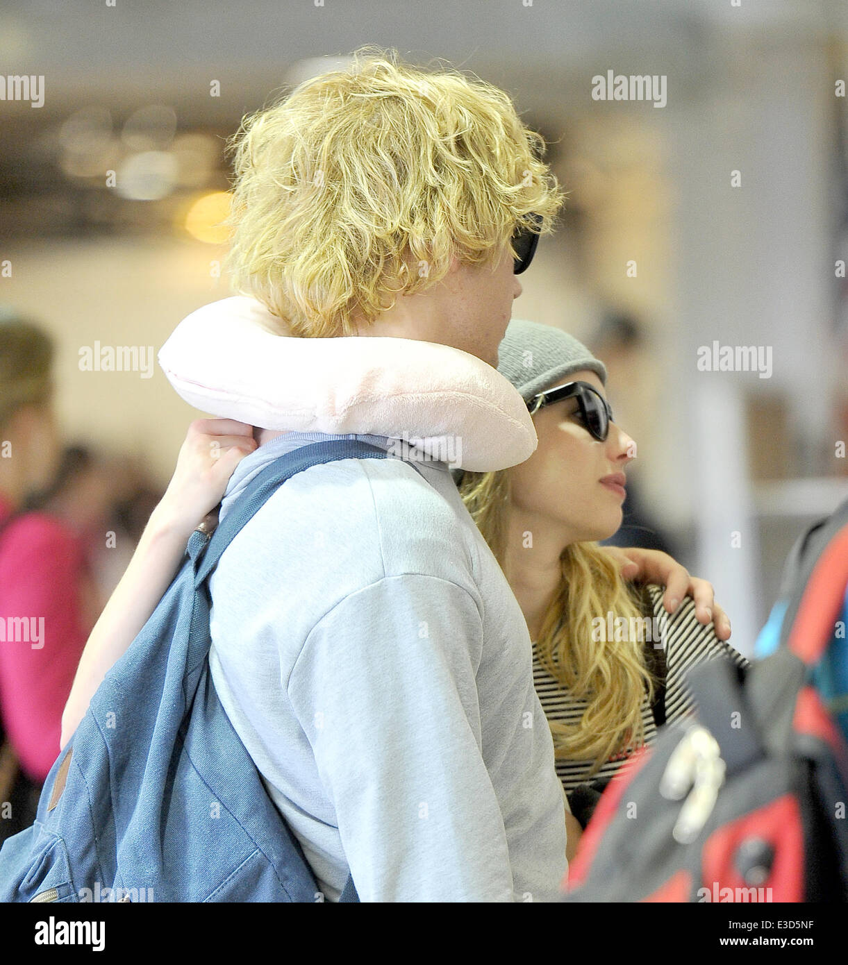 Emma Roberts and her boyfriend Evan Peters pack on the PDA at LAX as they catch a flight out of ...