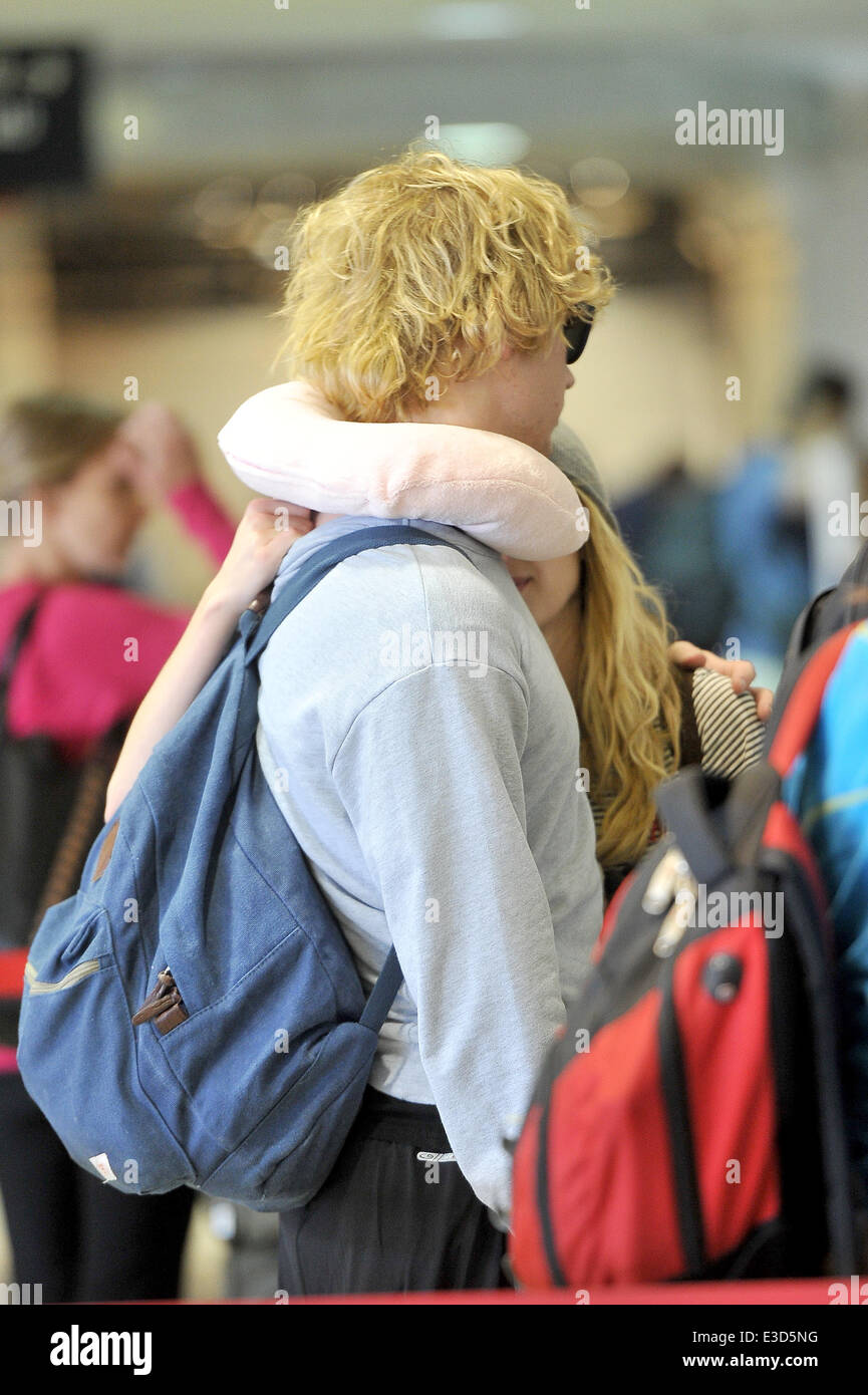 Emma Roberts and her boyfriend Evan Peters pack on the PDA at LAX as they catch a flight out of ...