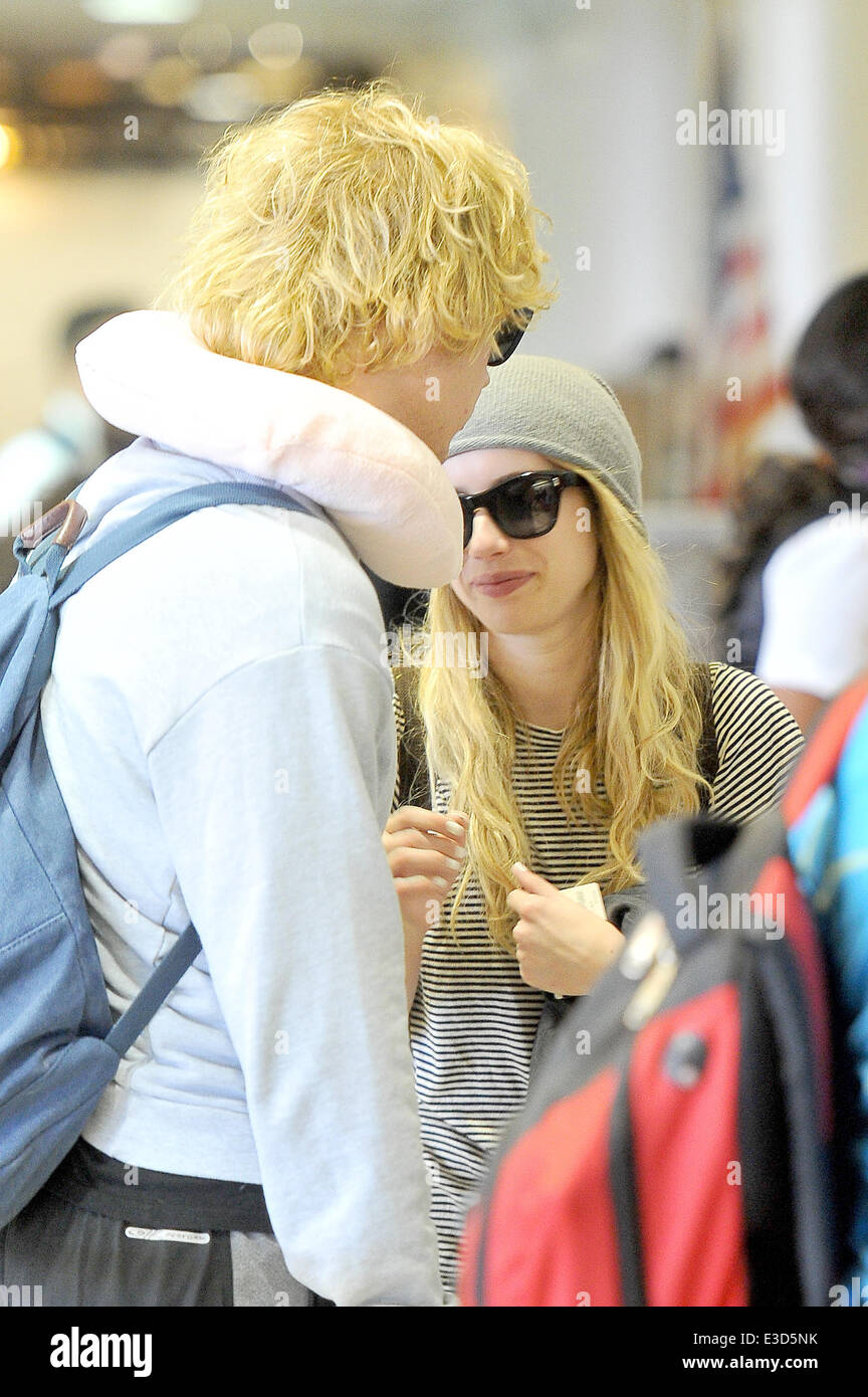 Emma Roberts and her boyfriend Evan Peters pack on the PDA at LAX as ...