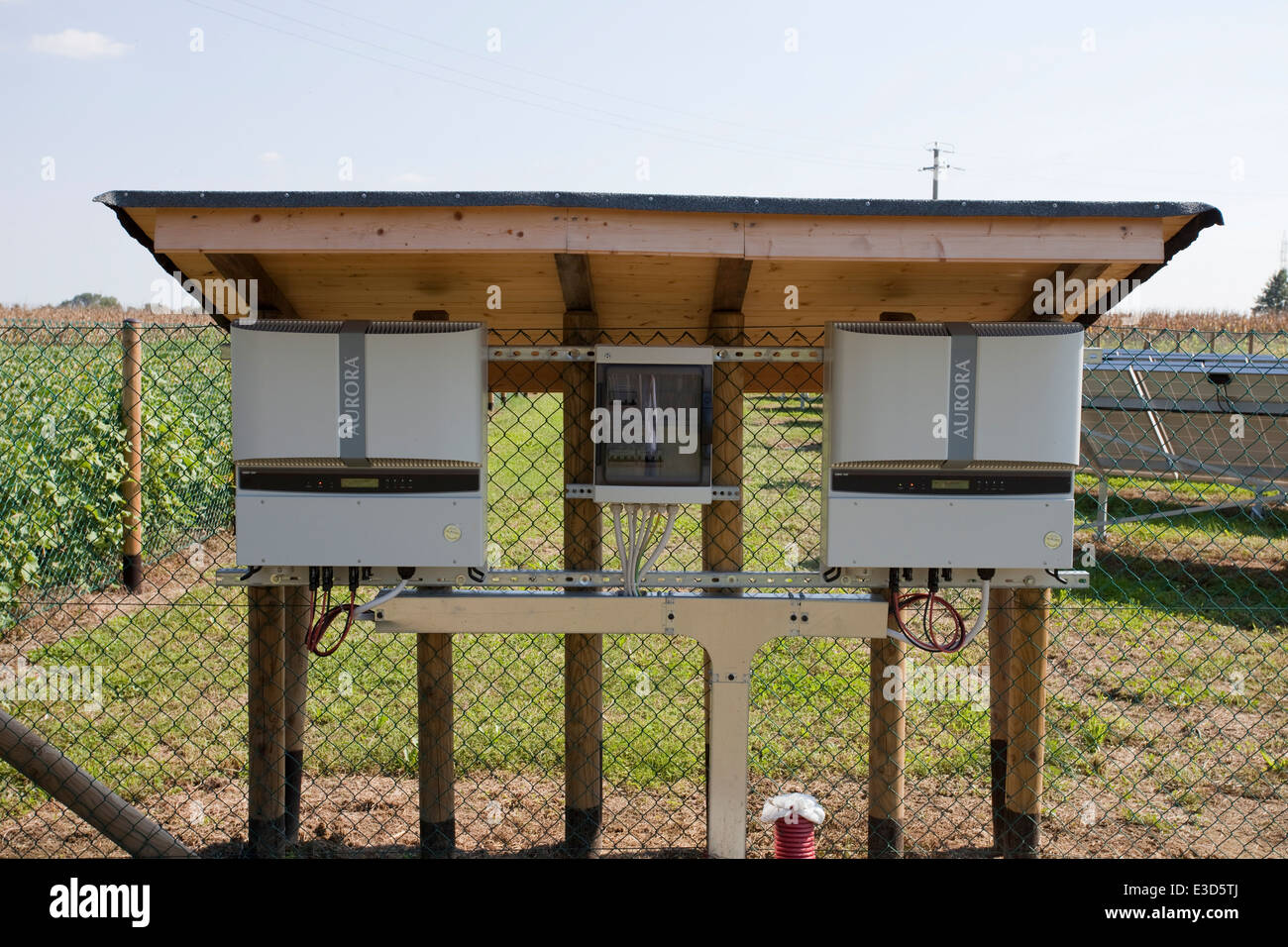 Ecology electric energy farm with solar panel battery in green field ...