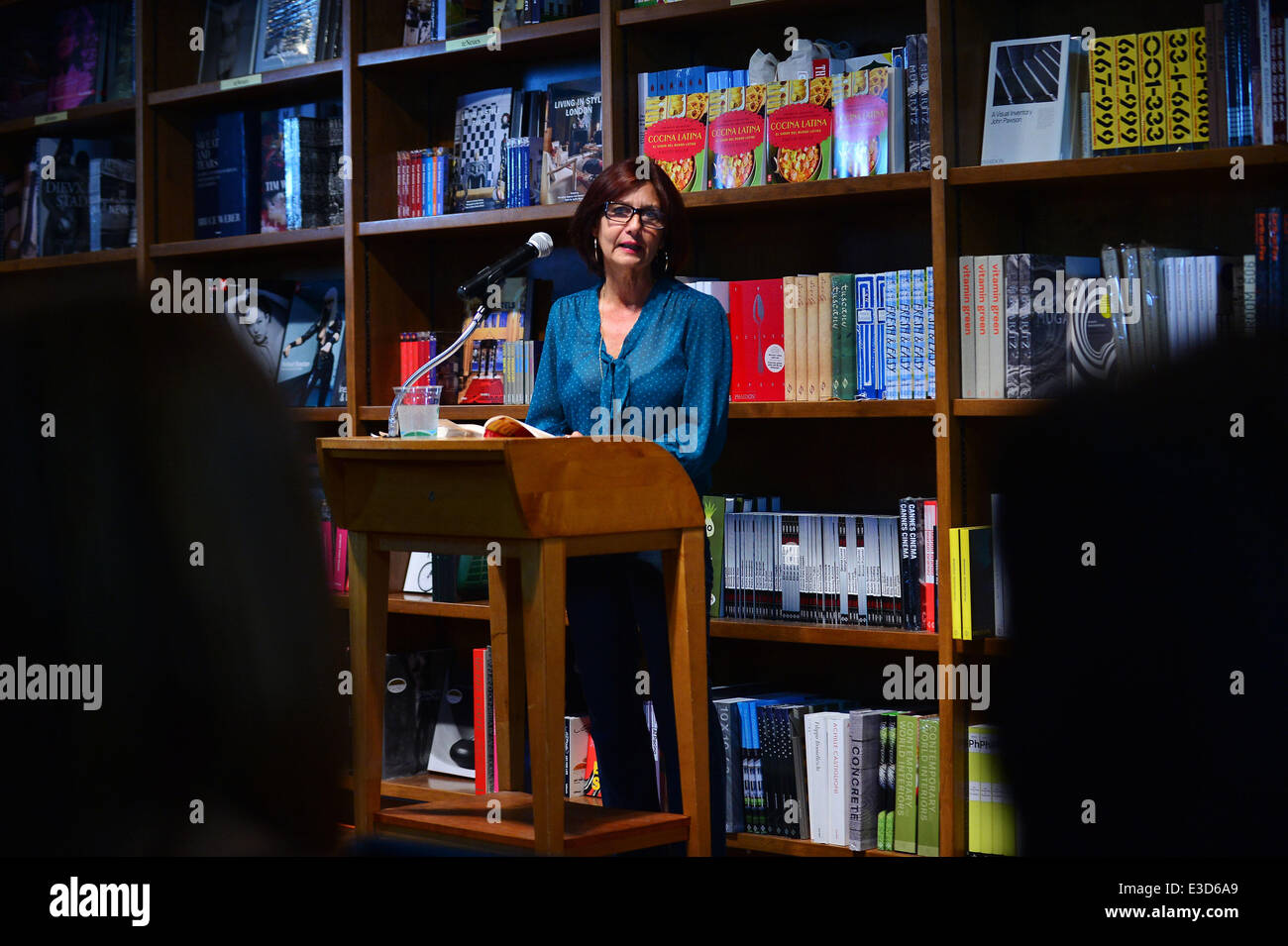 Bookstore owner and Cuban cookbook author Raquel Roque greets fans and ...